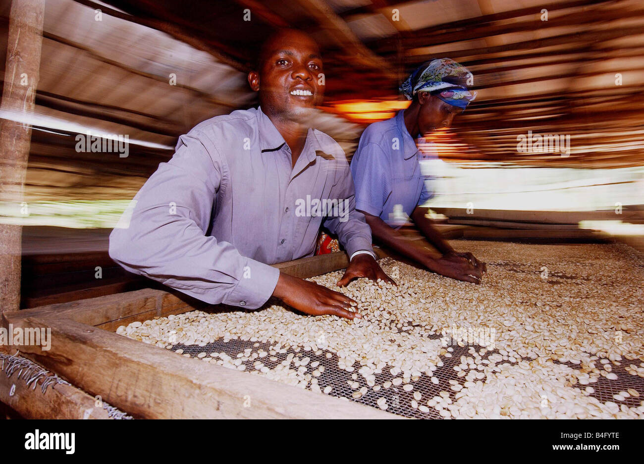Workers at the coffee making plant in the Rwandan village of Maraba ...