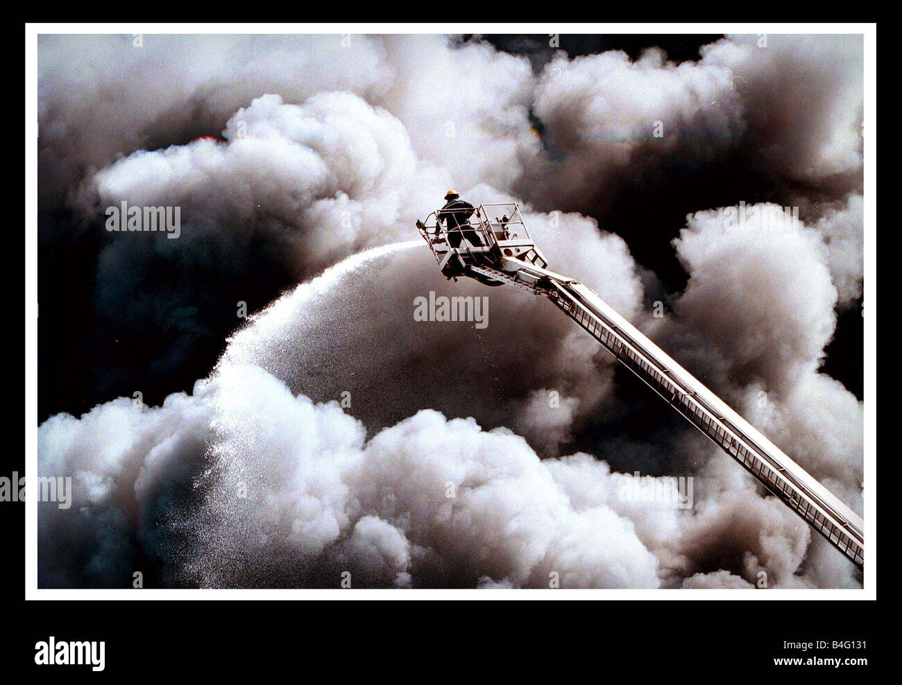 Fireman on turntable ladder uses water hose at Peebles Transformers ...