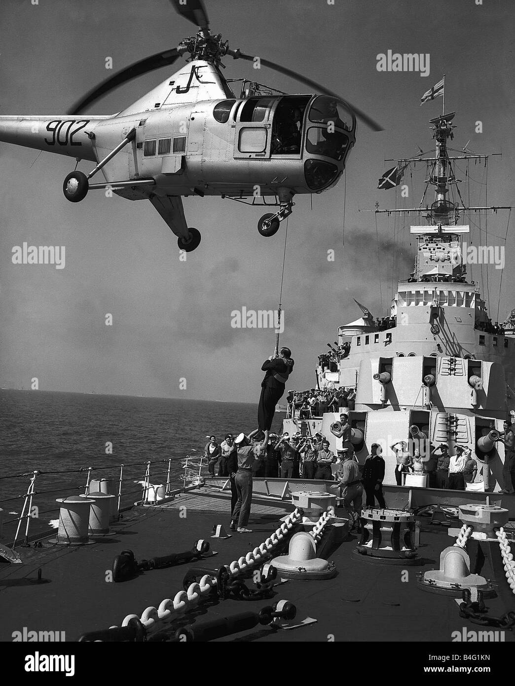 Richard Dimbleby descends from a Westland Dragonfly helicopter on to ...