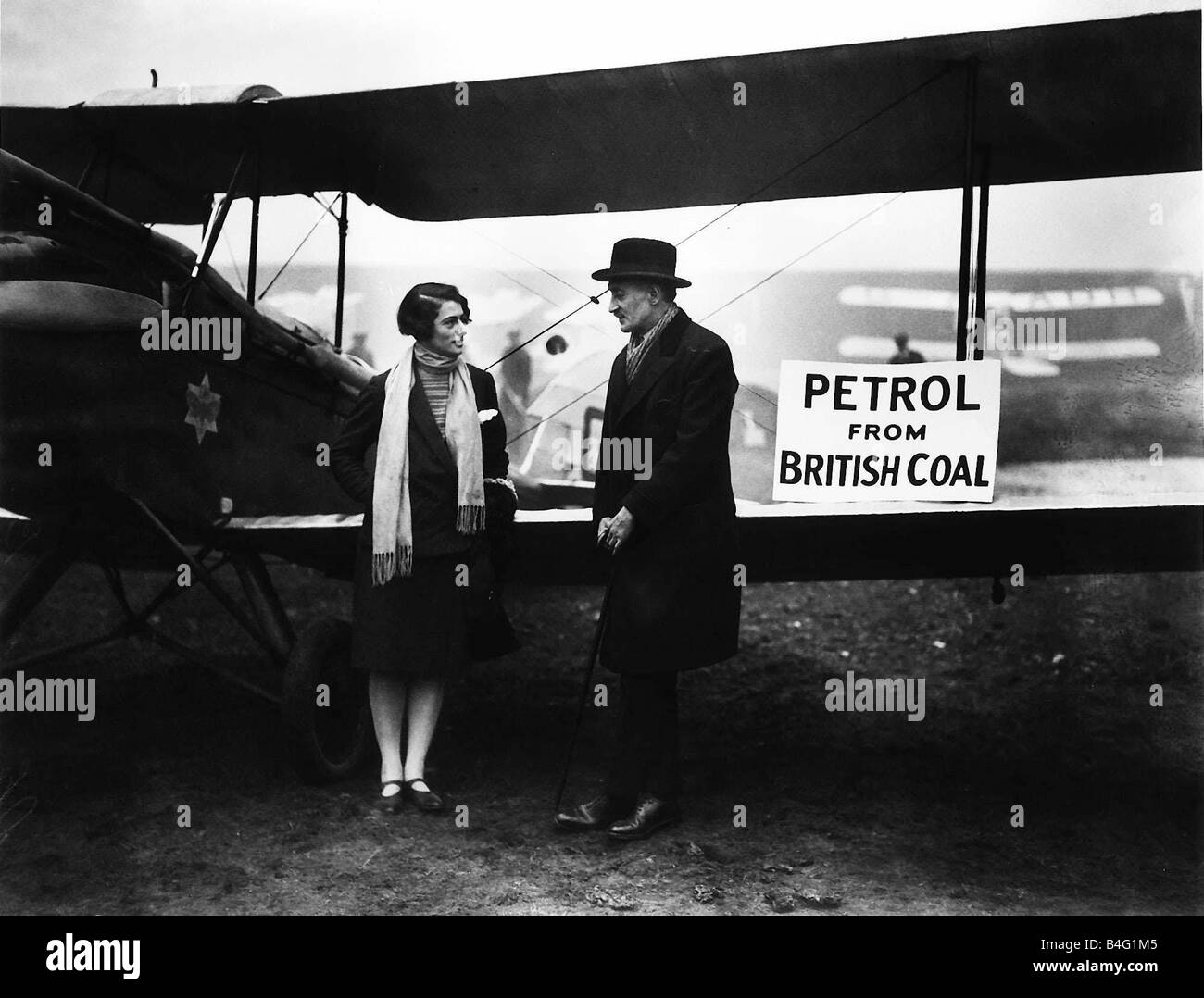 Lord Thomson with W E Spooner after successfully making petrol from ...