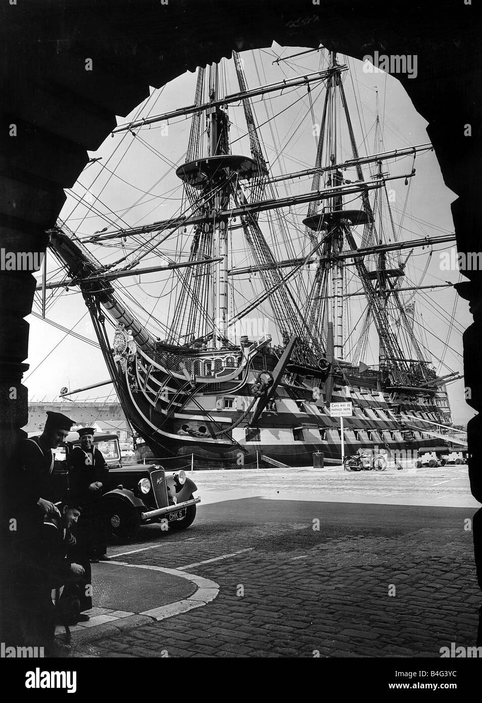 HMS Victory the flagship of the fleet framed in an arch in Portsmouth ...