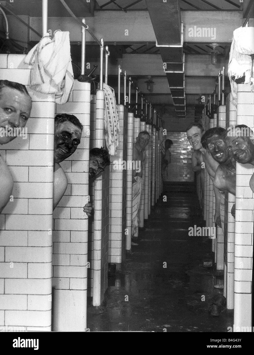 Miners in the pithead baths following a shift underground at Mosley ...