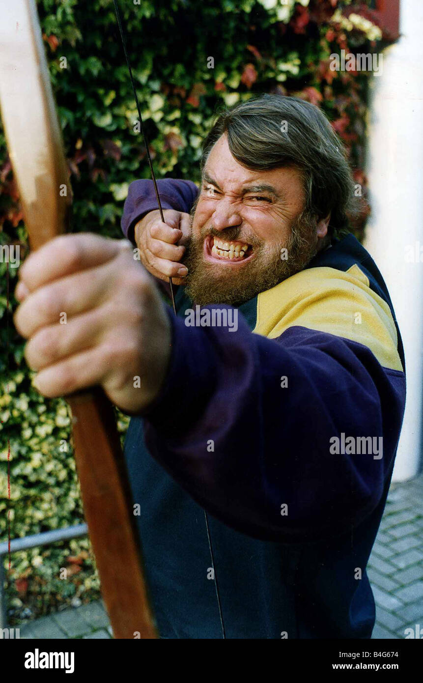 Brian Blessed actor pulling an 80lb crossbow Stock Photo - Alamy