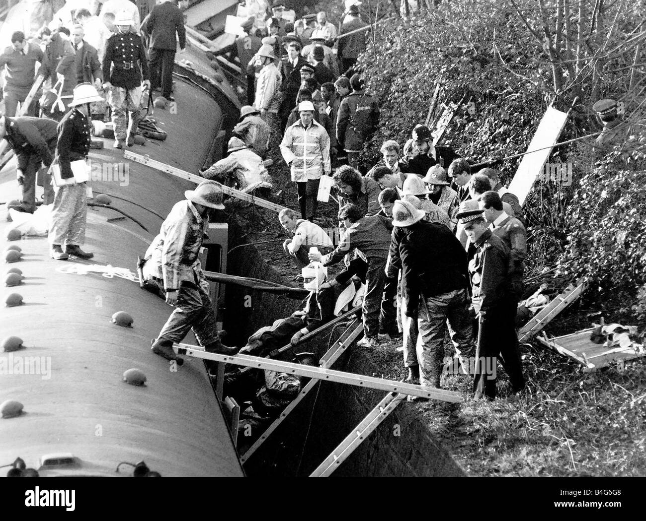 Firemen and Paramedics work in the wreckage of the Clapham rail ...