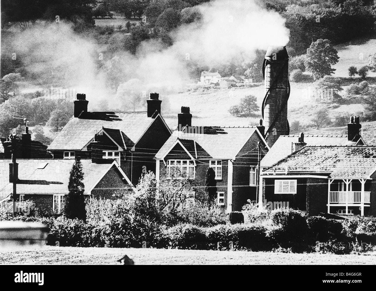 Pollution caused from smoke fumes pouring from the chimney of a Re Chem ...