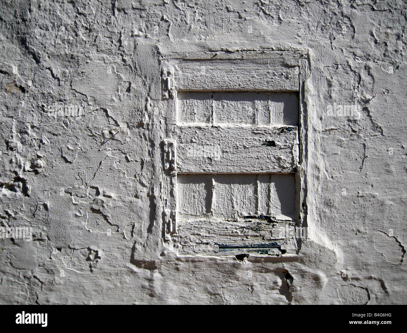 Wonderful texture of rough rendering and whitewash over an old window ...