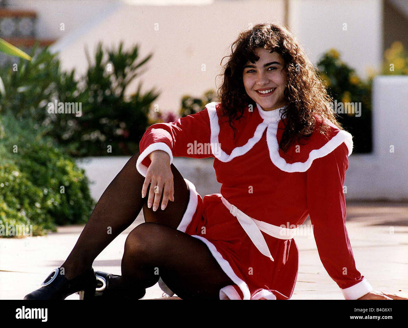 Actress Sandra Sandri by the pool wearing Santa outfit on the set of ...