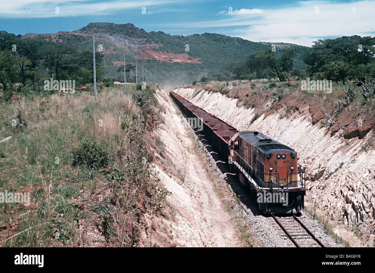 A loaded iron ore train heads for the port of Mocamedes in South West ...