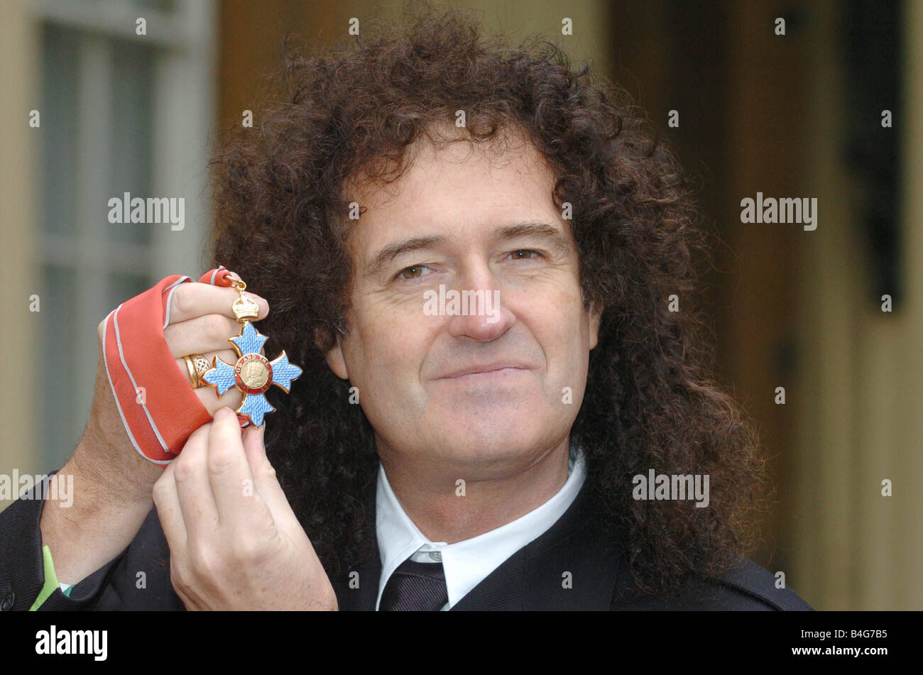 Brian May seen here in the courtyard of Buckingham Palace following the ...