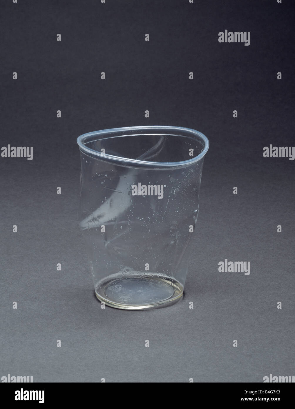 An empty crushed plastic cup Stock Photo - Alamy