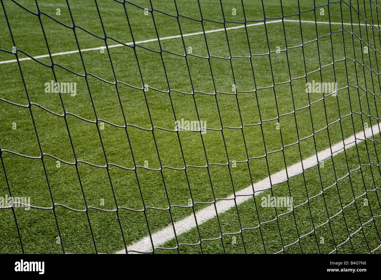 The net of a soccer goal, close up, and a soccer field Stock Photo - Alamy