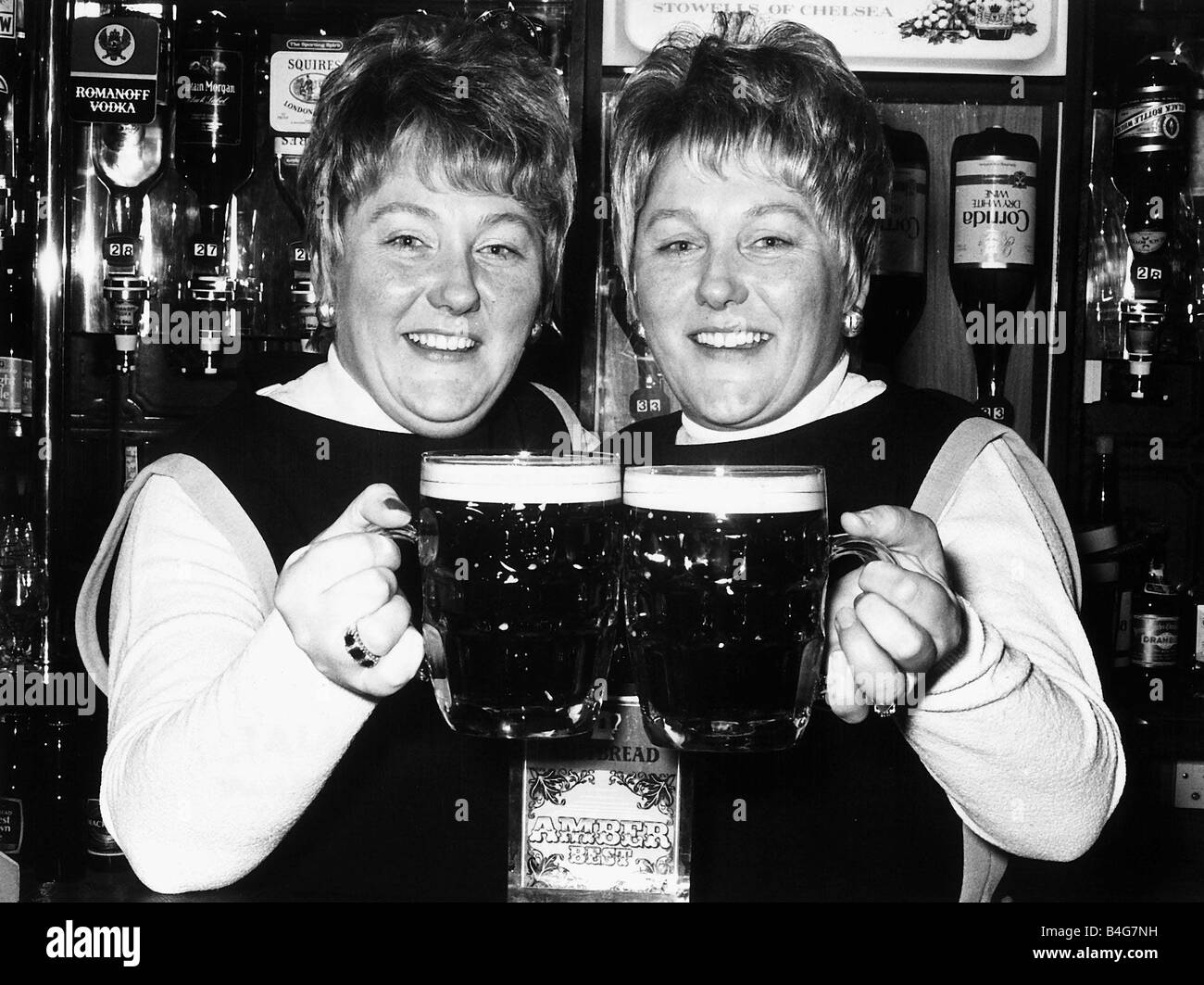 Identical twin barmaids Joan Metcalf and Marie Dunn seen here behind ...