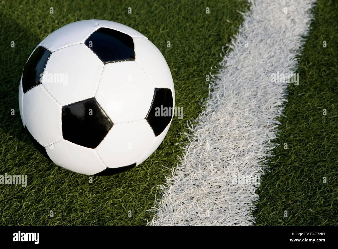 A soccer ball on a soccer field Stock Photo - Alamy