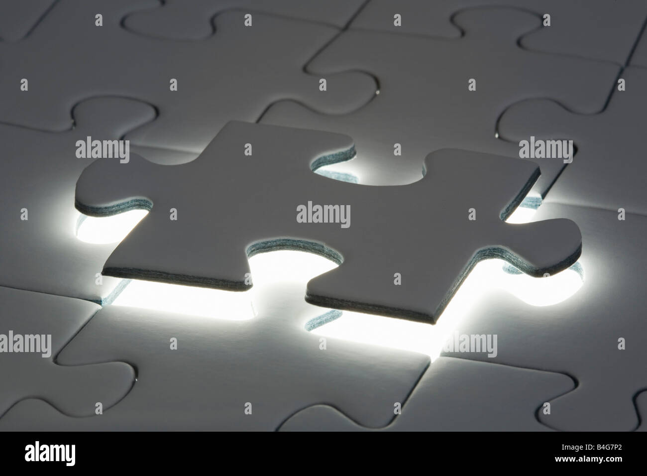 Final piece to a jigsaw puzzle Stock Photo - Alamy