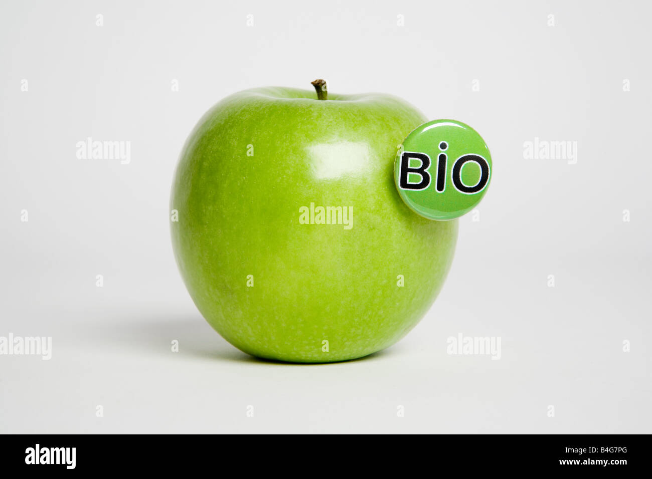 A green apple with a 'Bio' button in it Stock Photo - Alamy