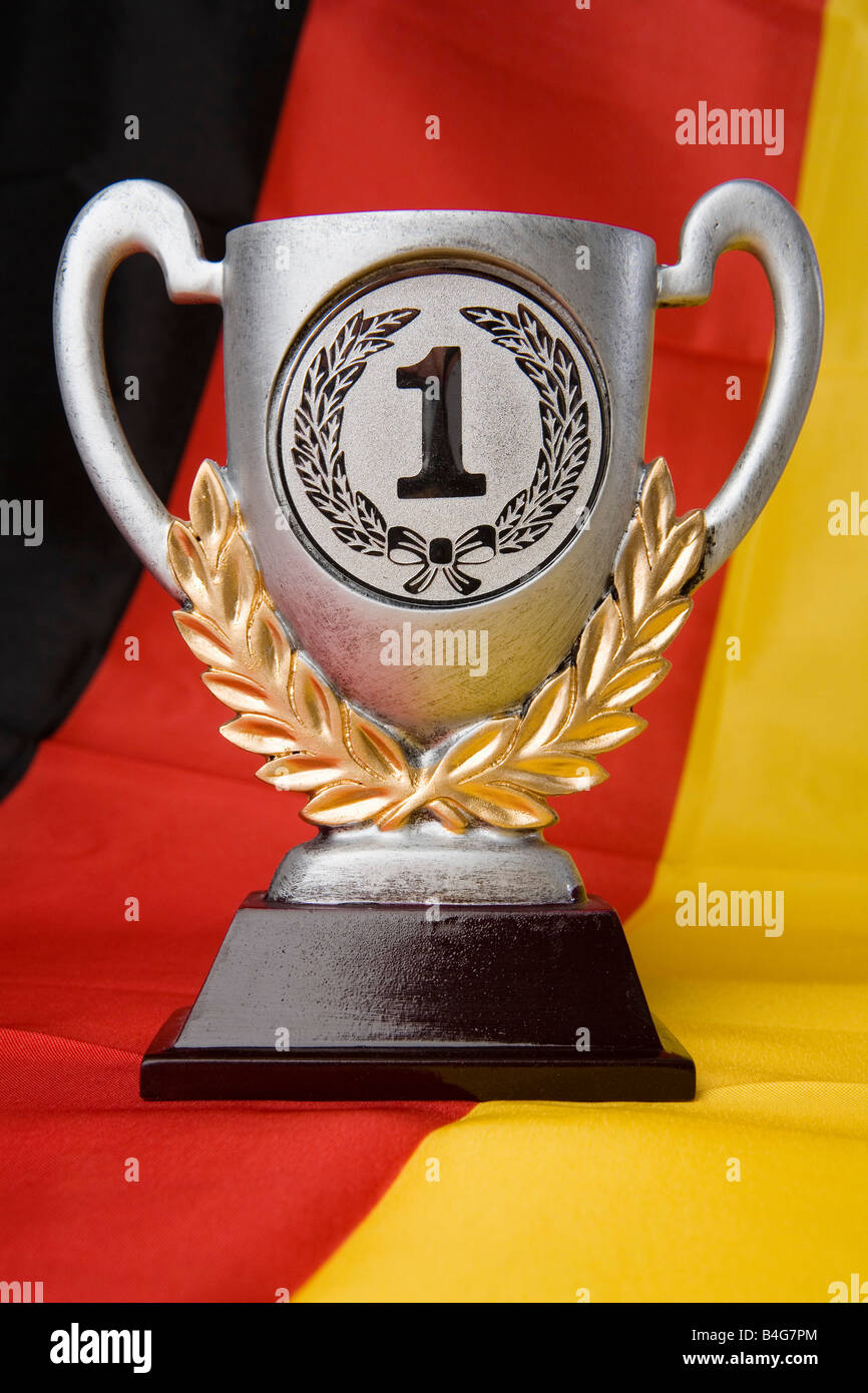 First place trophy sitting on a German flag Stock Photo - Alamy