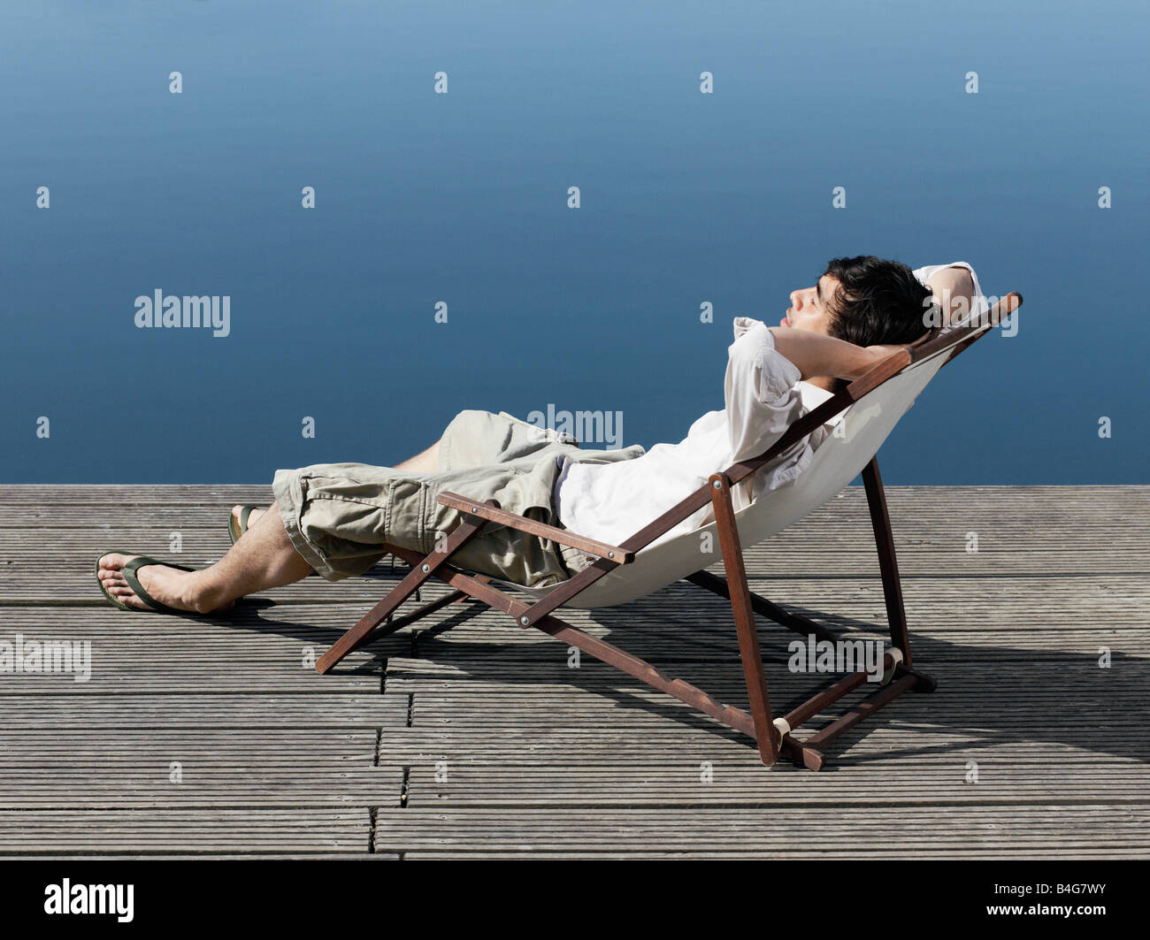 Man Sitting In Deck Chair High Resolution Stock Photography and Images ...