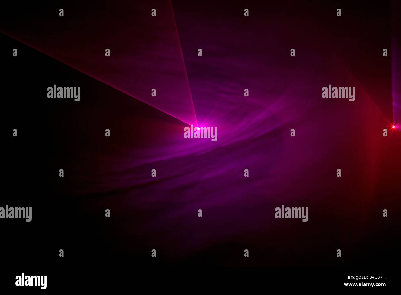 Pink and red laser lights Stock Photo - Alamy