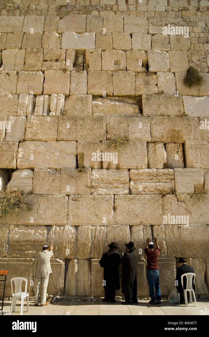 Five men praying at the Wailing Wall, rear view Stock Photo - Alamy