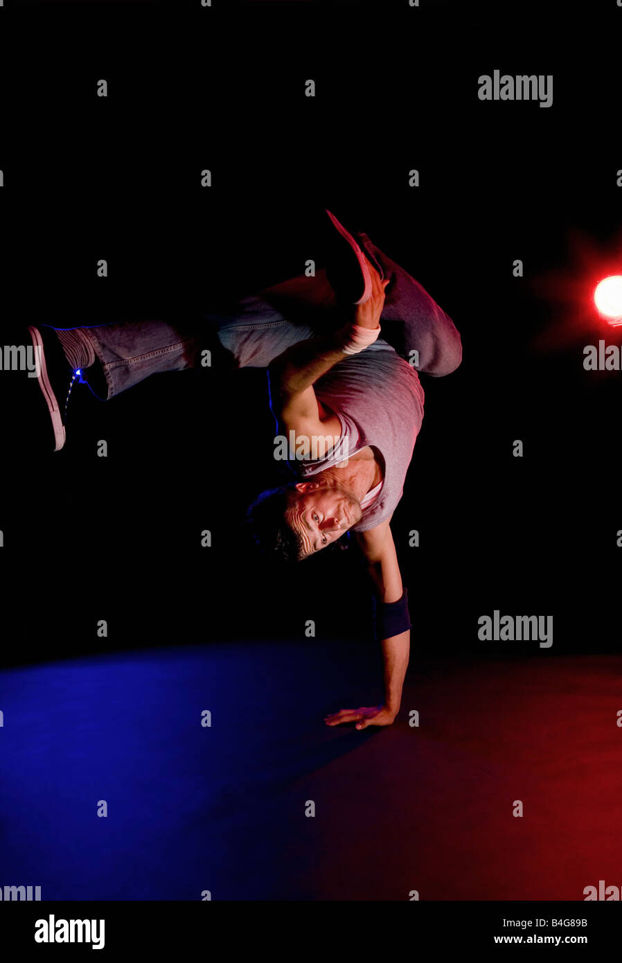 A B-boy doing a One-handed Freeze breakdance move Stock Photo - Alamy