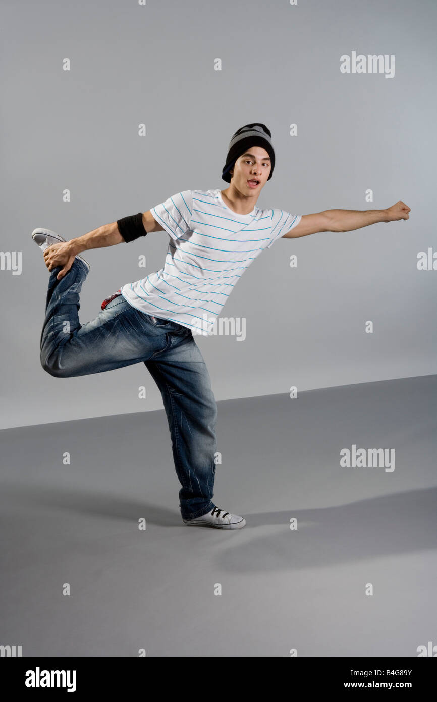 Portrait of a B-boy stretching Stock Photo - Alamy