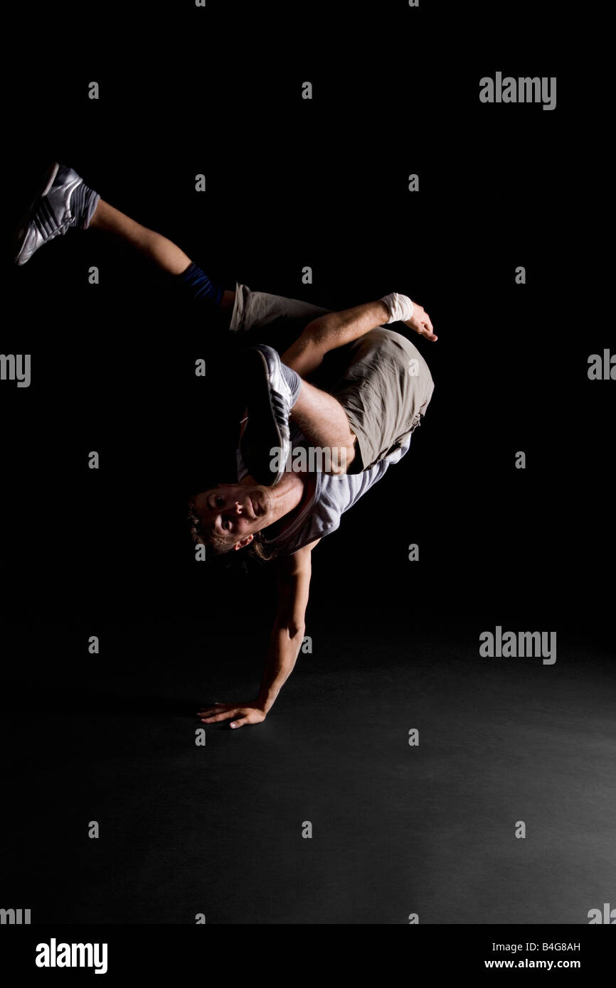 A B-boy doing a One-handed Freeze breakdance move Stock Photo - Alamy