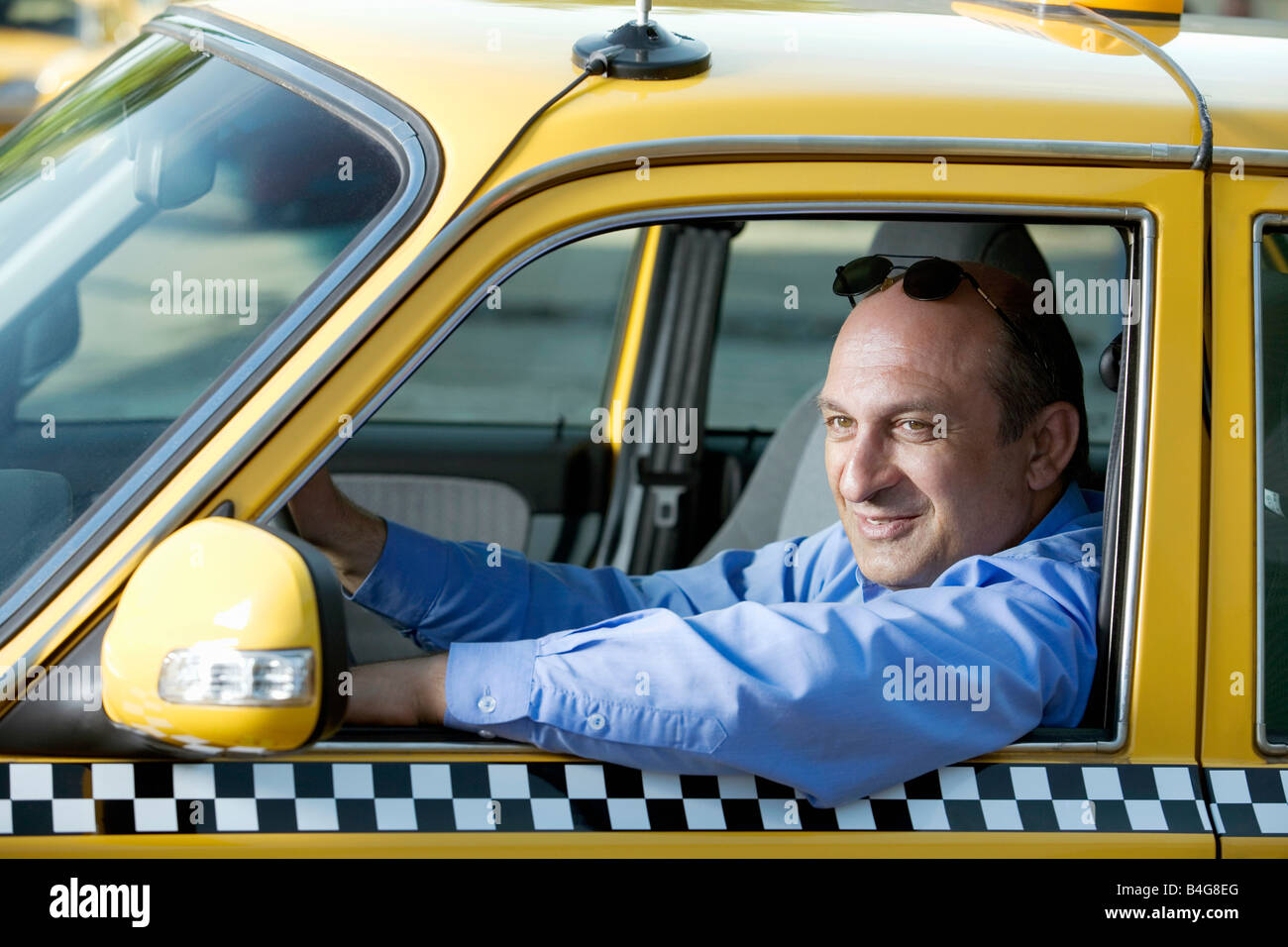 A taxi driver sitting in his car Stock Photo - Alamy