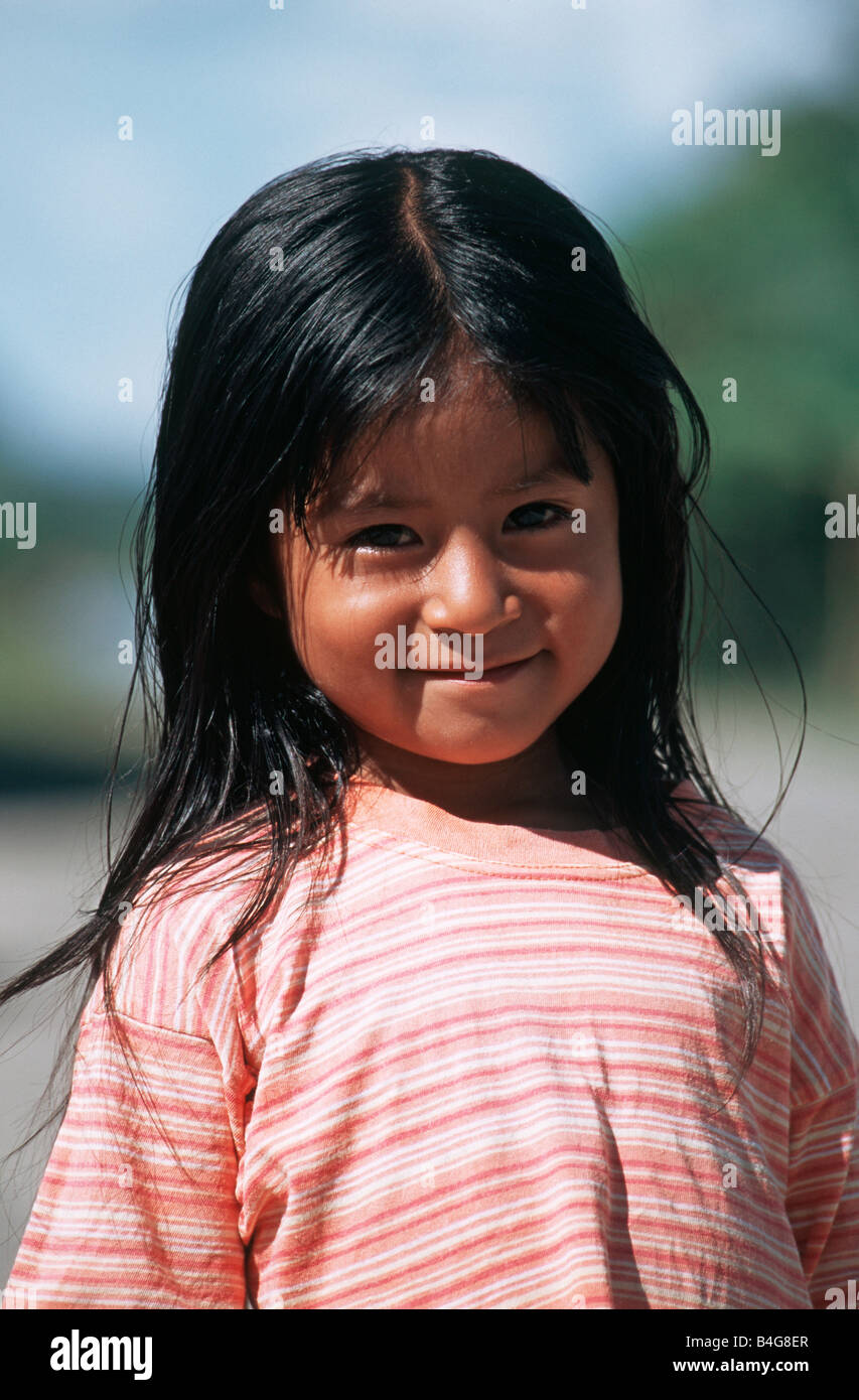A portrait of a young pretty local Ecuadorian girl as she poses for the ...