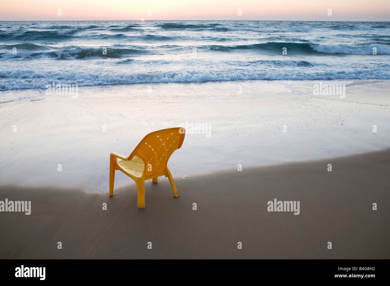 A plastic chair on the beach Stock Photo - Alamy