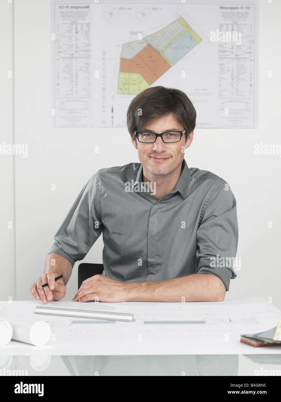 An architect sitting at his desk Stock Photo - Alamy