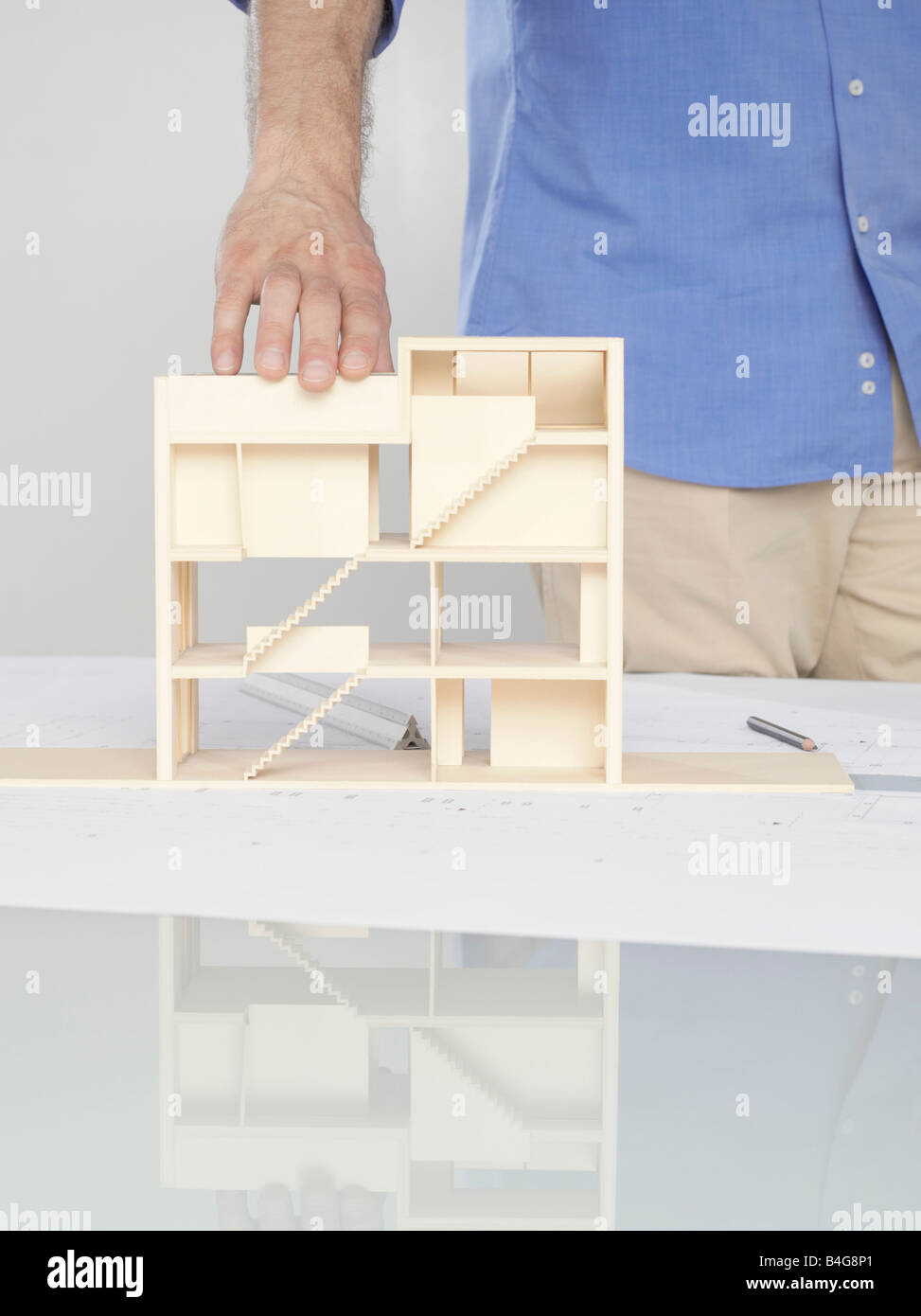 A man looking at an architectural model Stock Photo - Alamy