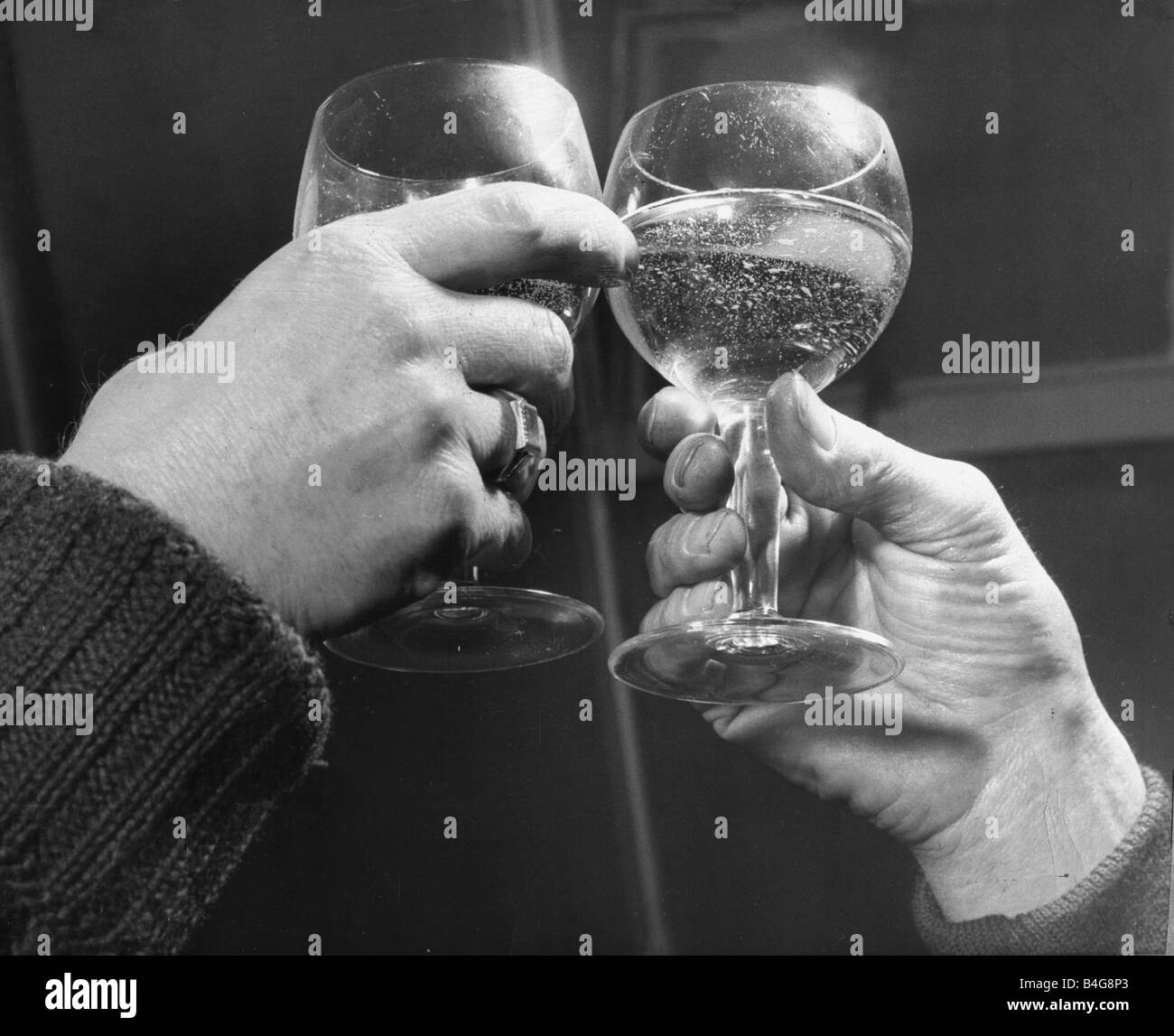 Two wine glasses toasting the old codgers Circa 1955 Stock Photo - Alamy