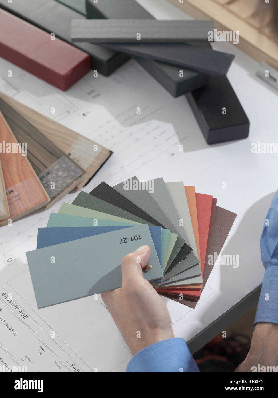 A person comparing color swatches Stock Photo - Alamy
