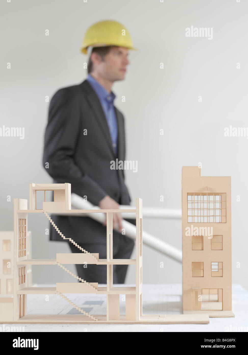 An architect standing behind an architectural model Stock Photo - Alamy