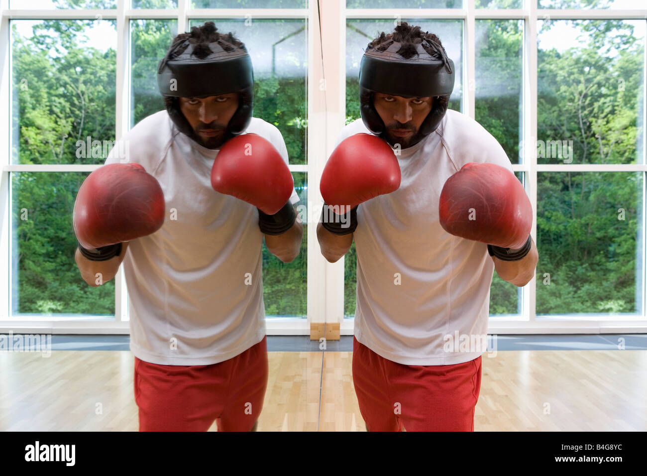 A boxer standing next to a mirror Stock Photo - Alamy
