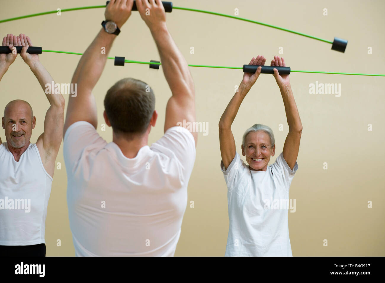 A fitness instructor teaching a Aerobic Flex Bar class Stock Photo - Alamy