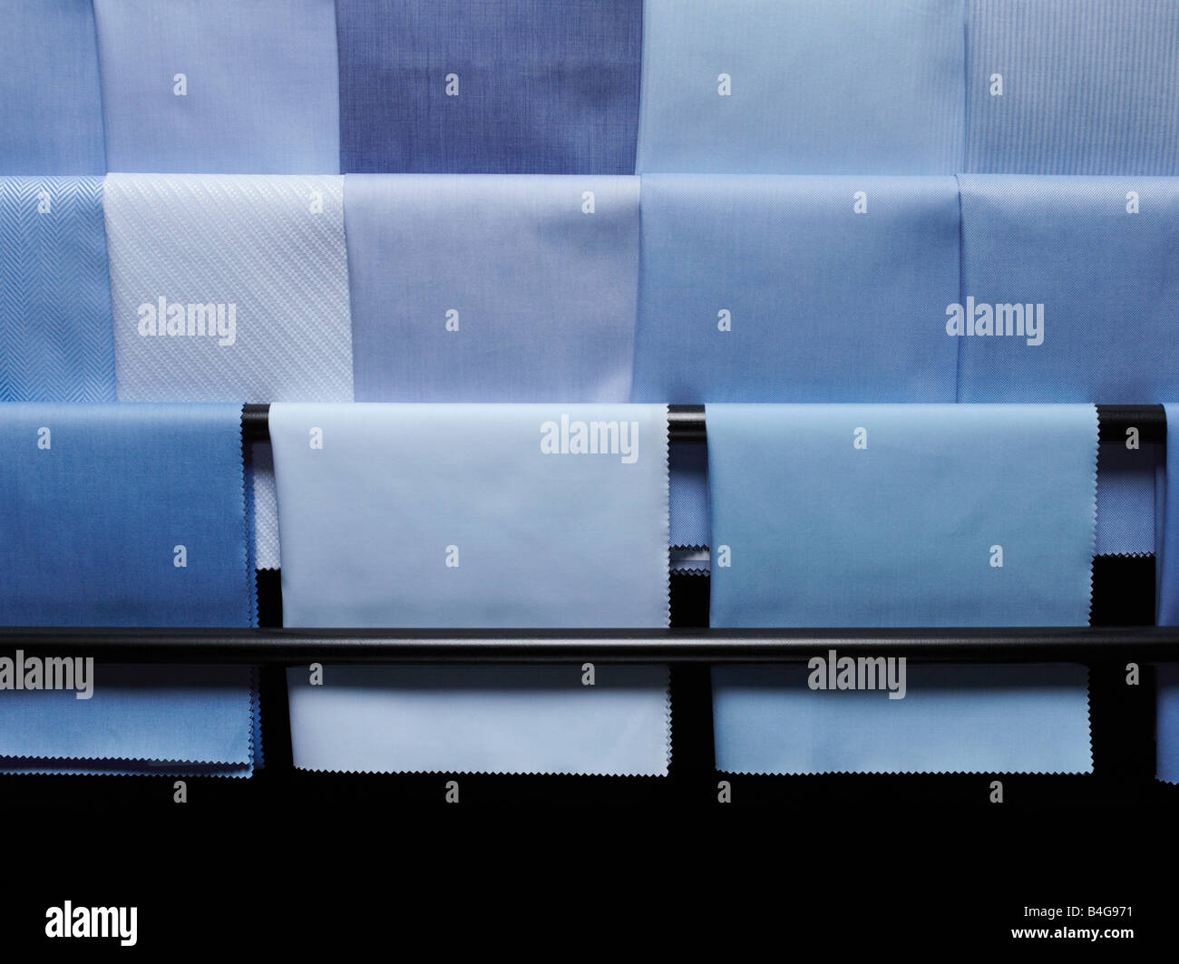 Blue fabric swatches on a rack Stock Photo - Alamy