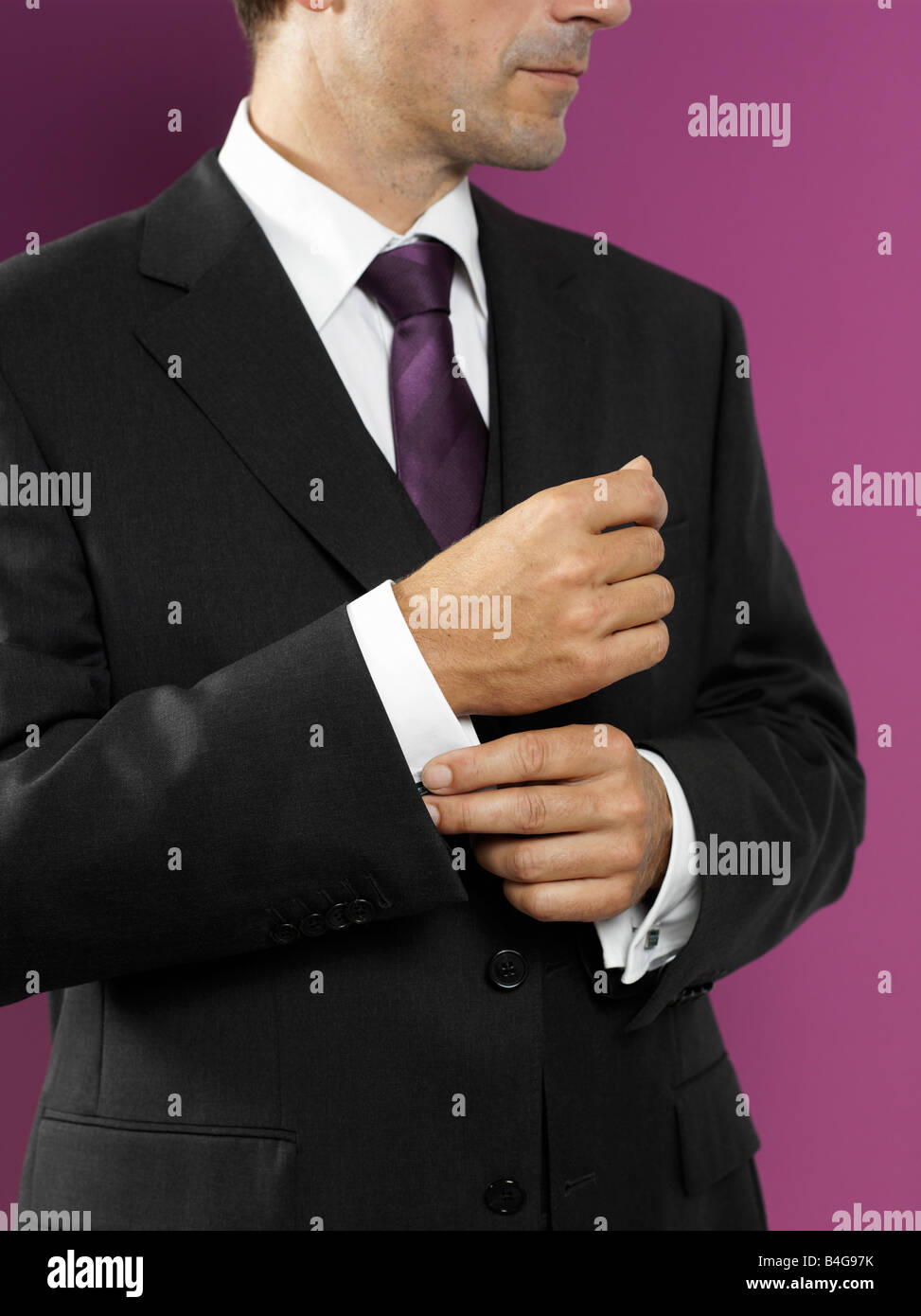 A man fastening his cufflink Stock Photo - Alamy