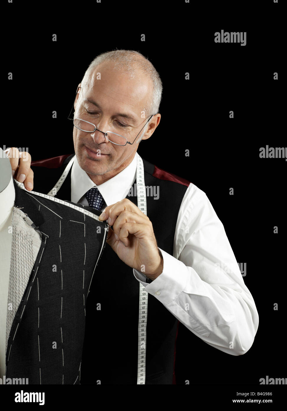 A tailor making a suit Stock Photo - Alamy