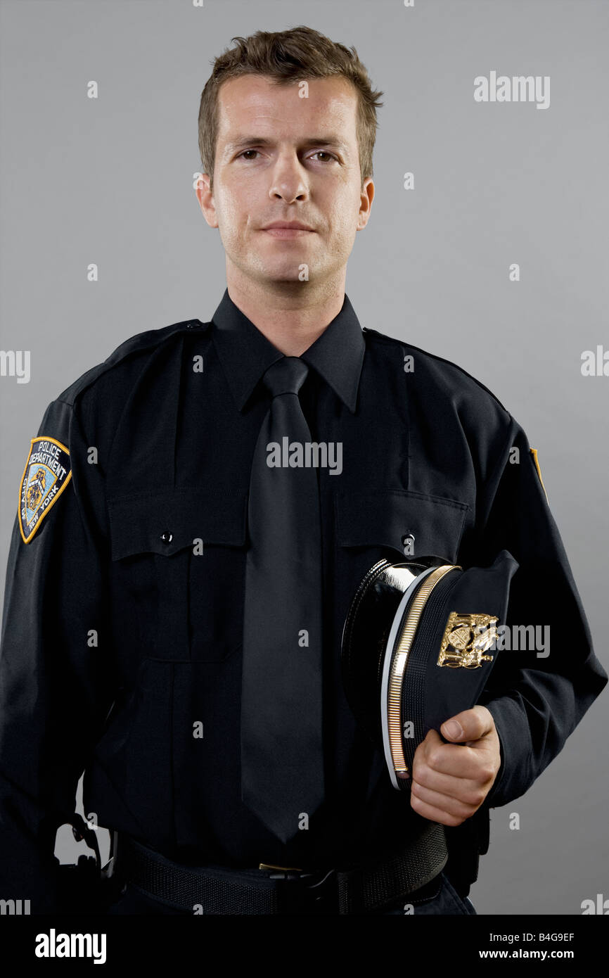 Officer holding badge hi-res stock photography and images - Alamy
