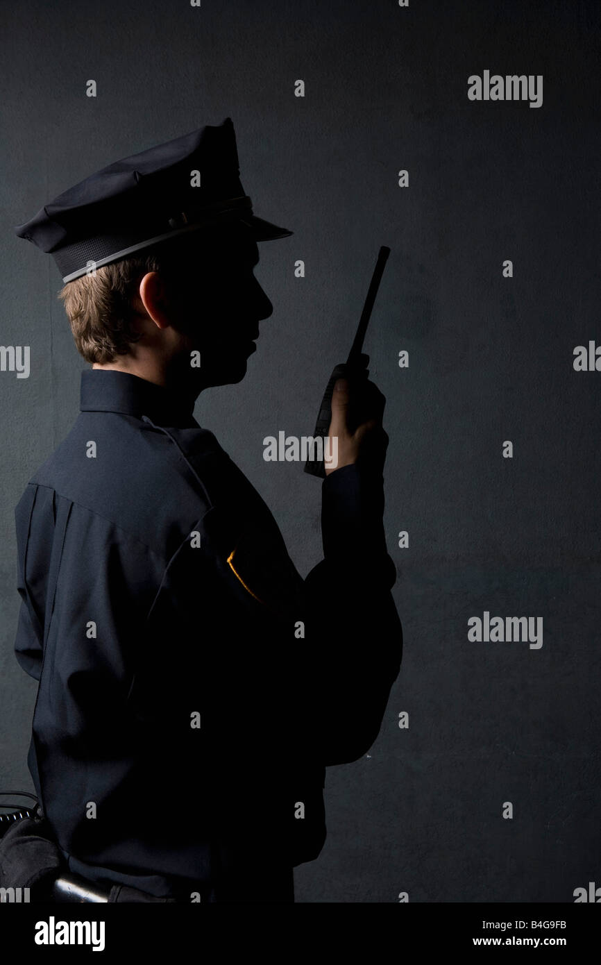 A police officer using a radio Stock Photo - Alamy