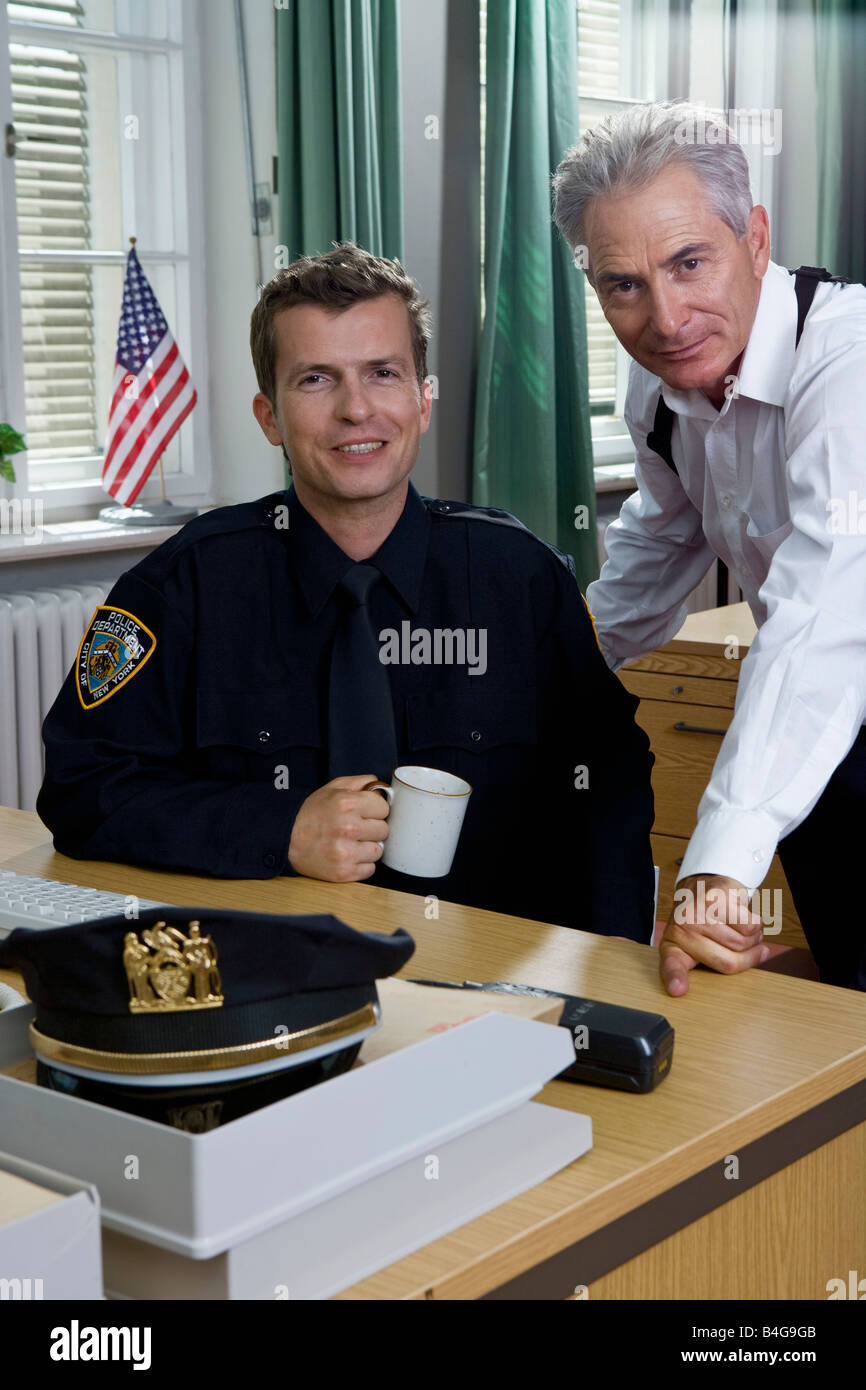 Two police officers working in an office Stock Photo - Alamy