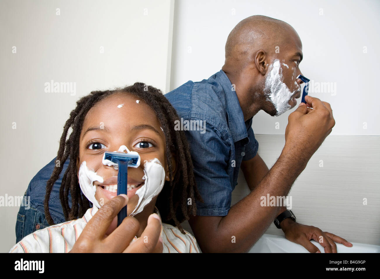 A son imitating his father shaving Stock Photo - Alamy
