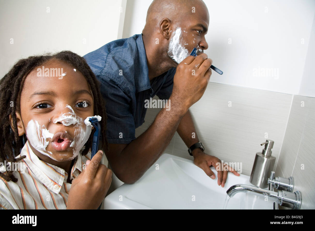 A son imitating his father shaving Stock Photo - Alamy