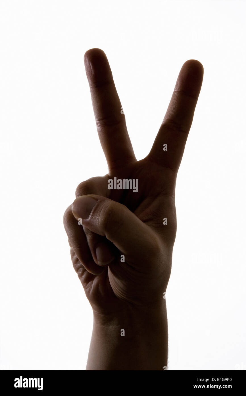 A hand making a peace sign Stock Photo - Alamy
