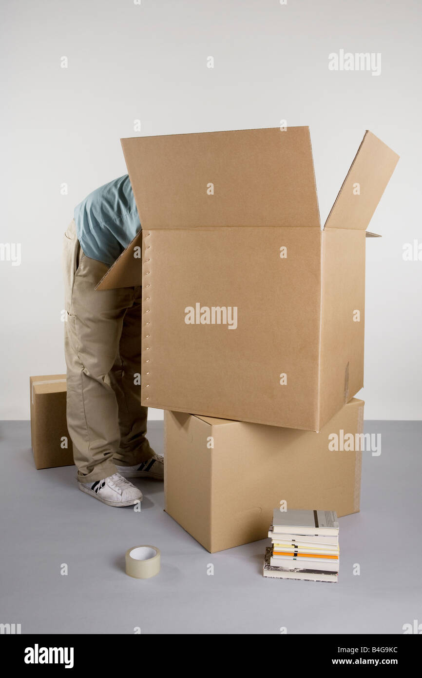 A person packing boxes Stock Photo - Alamy