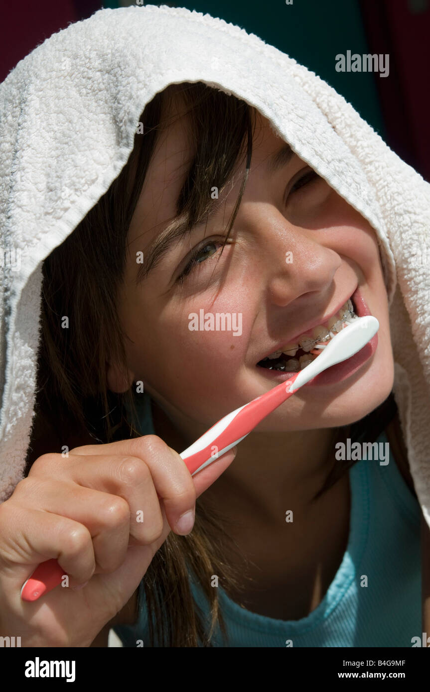 Girl holding towel over head hi-res stock photography and images - Alamy