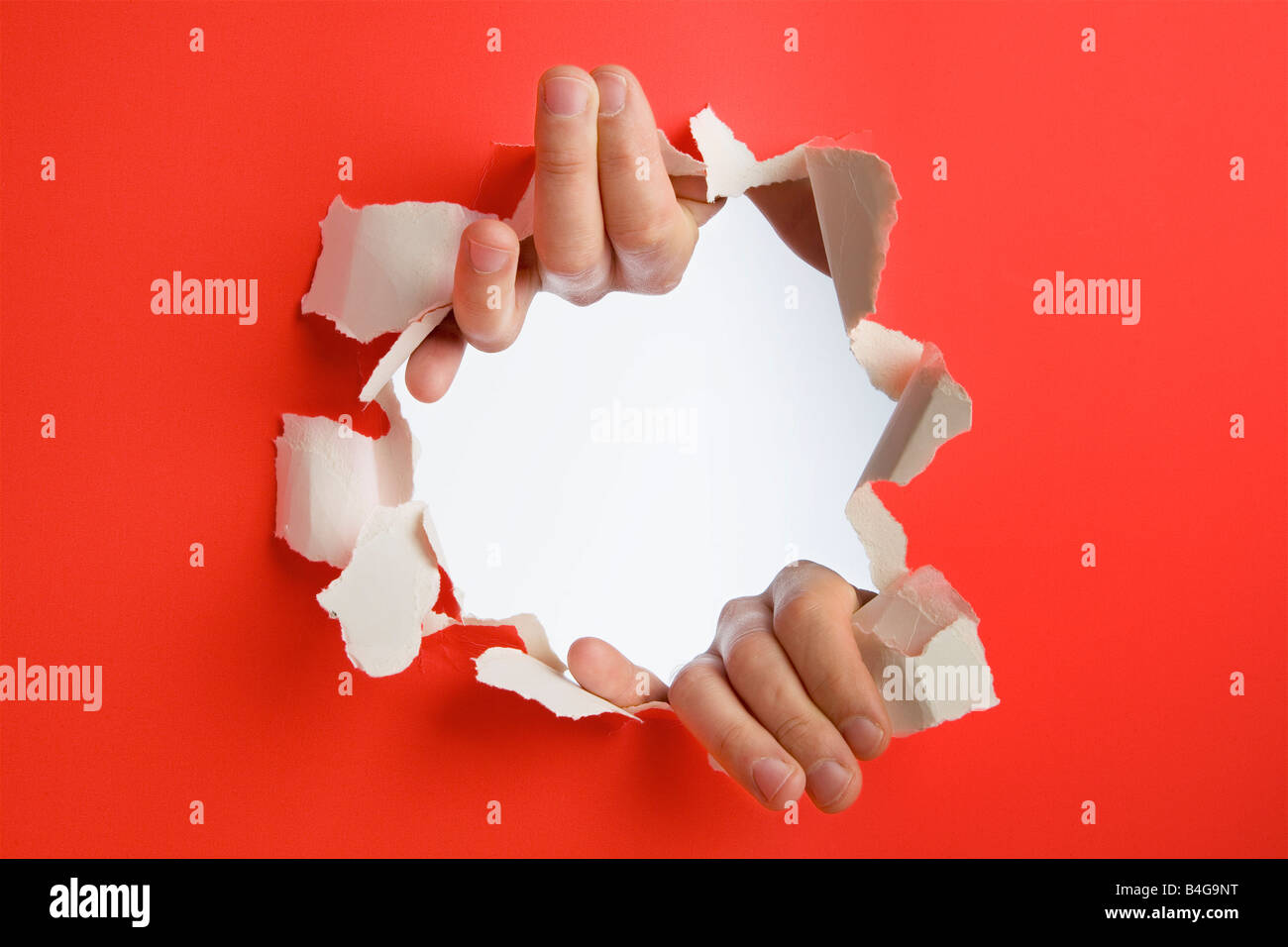 Hands breaking through wall hi-res stock photography and images - Alamy