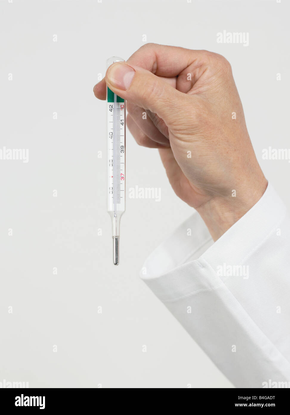 Human hand holding a thermometer Stock Photo - Alamy