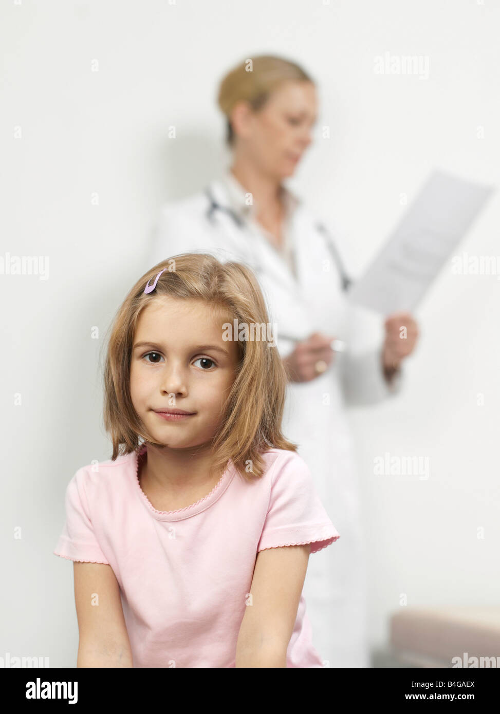 A young girl looking nervous at medical exam Stock Photo - Alamy